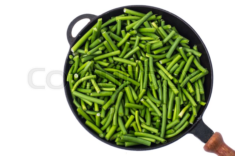 Cut into pieces of green beans in ... | Stock image | Colourbox
