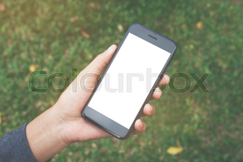 Close-up on hand hold phone showing ... | Stock image | Colourbox