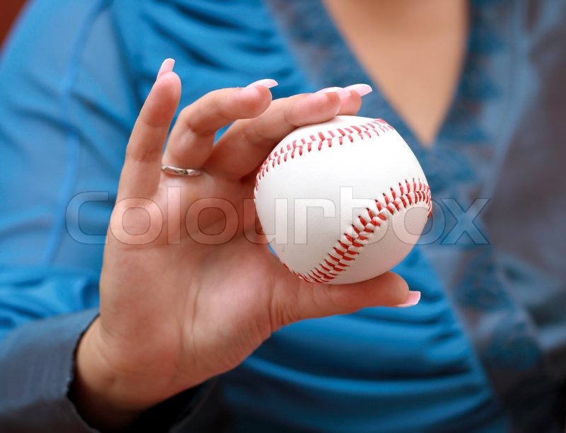 Baseball in woman hand | Stock image | Colourbox