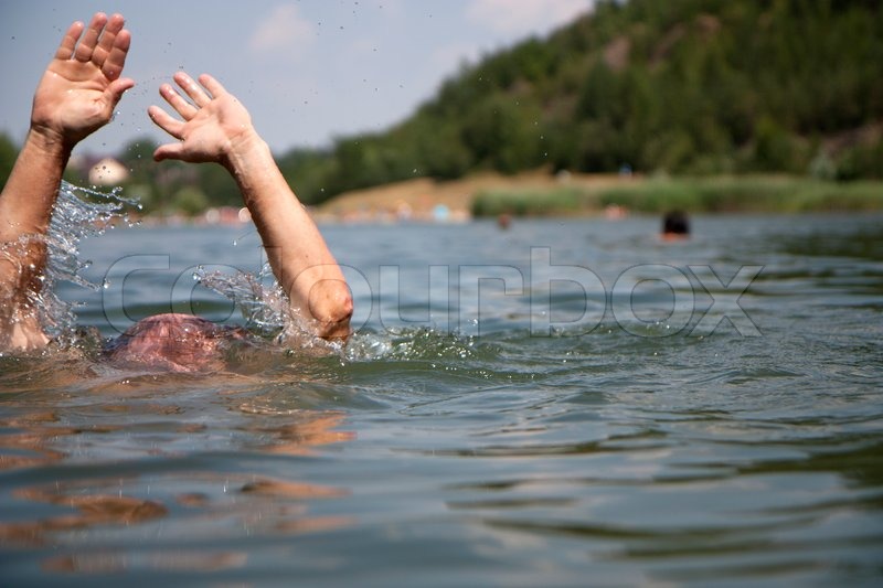 Drowning swimmer at a lake in summer | Stock Photo | Colourbox