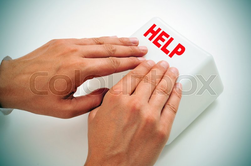 A man pressing a giant help key with ... | Stock image | Colourbox