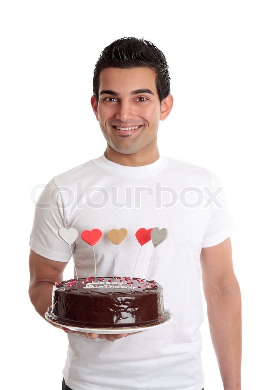 Smiling man holding a chocolate ... | Stock image | Colourbox