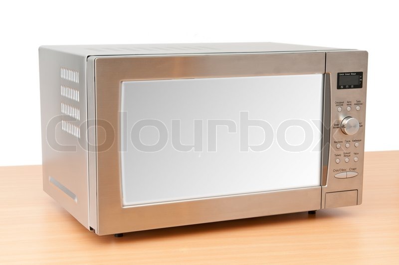 Microwave oven on the table | Stock image | Colourbox
