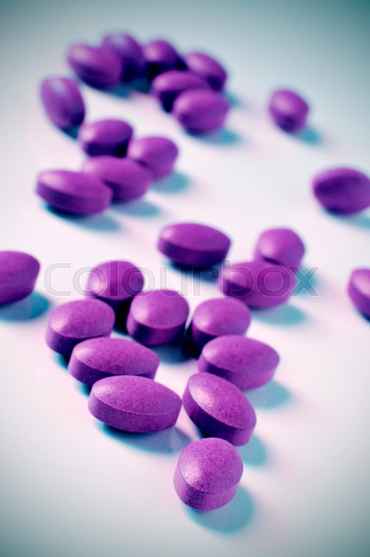 A pile of violet pills | Stock image | Colourbox