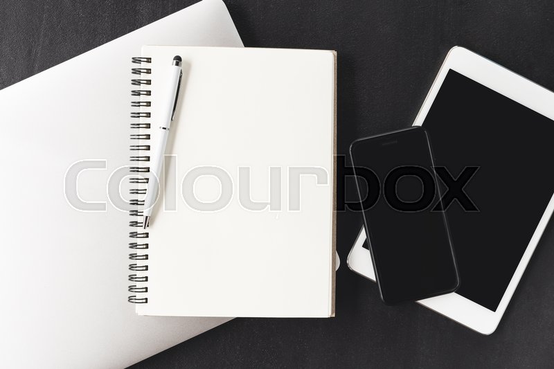 Notebook blank page stack on laptop ... | Stock image | Colourbox