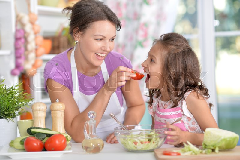 Mother and daughter preparing dinner ... | Stock image | Colourbox
