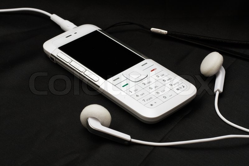 Hvid mobiltelefon på sort baggrund | Stock foto | Colourbox