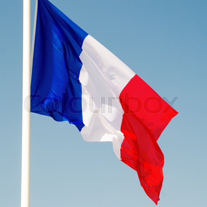 Waving french flag with blue sky | Stock image | Colourbox