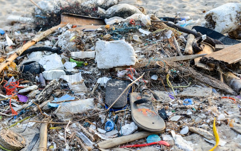 Junk on dirty beach many unused things ... | Stock image | Colourbox