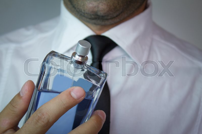 Man with perfume | Stock Photo | Colourbox
