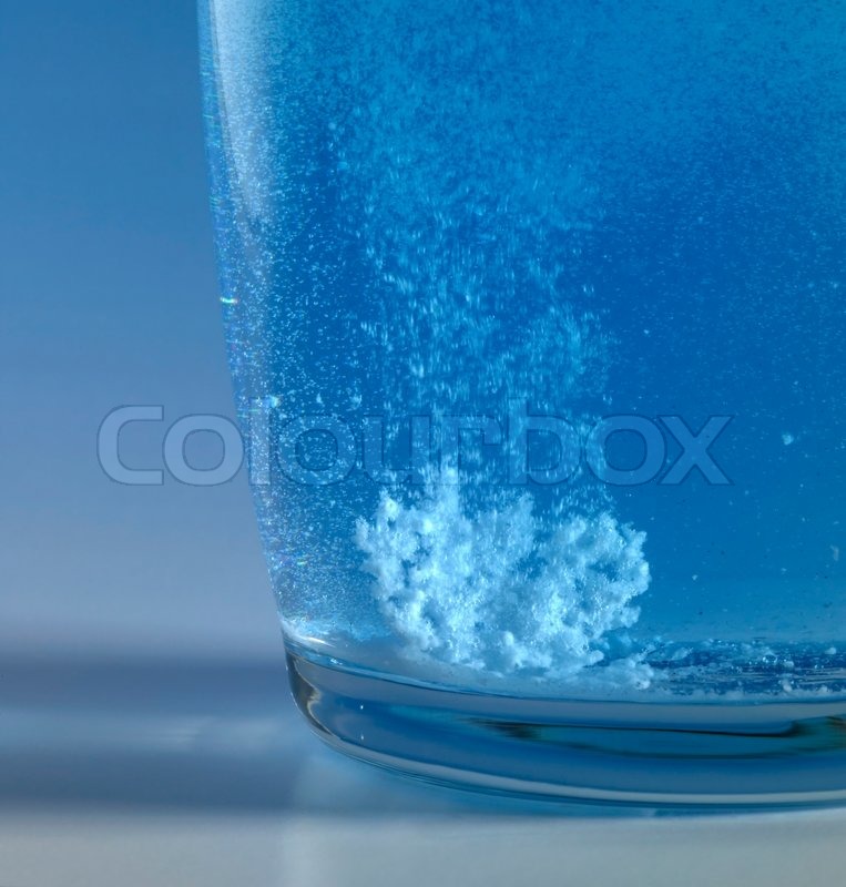 Fizzy tablet in a glass of water | Stock image | Colourbox