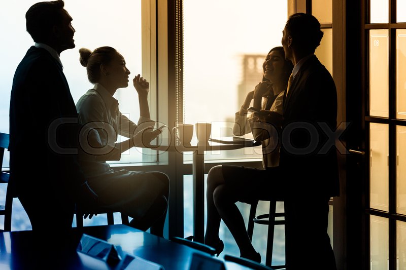 Group of office employees having coffee ... | Stock image | Colourbox