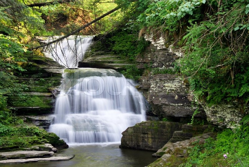 Small waterfall cascading over rocks | Stock image | Colourbox