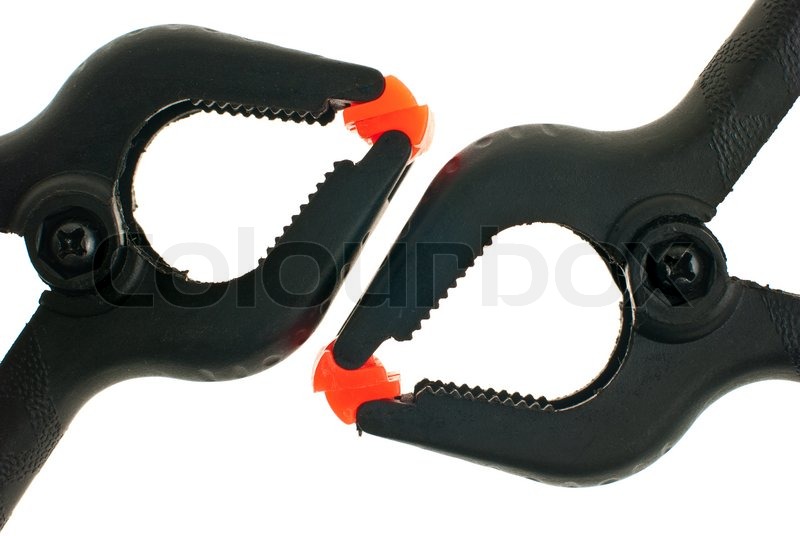 Red and black plastic clamps isolated ... | Stock image | Colourbox