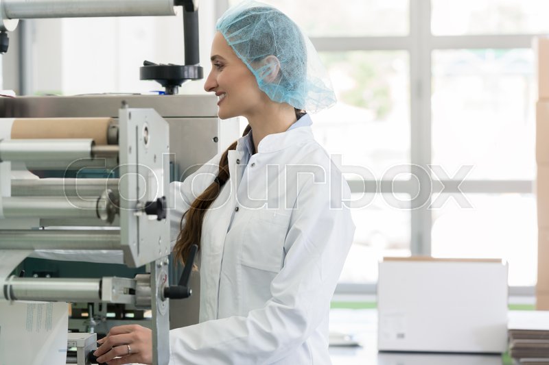 Happy female manufacturing operator ... | Stock image | Colourbox