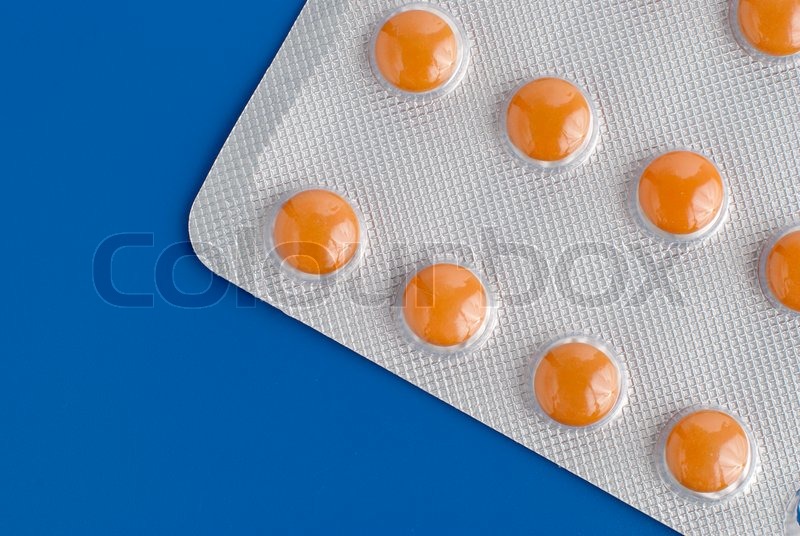Close-up of a pack of orange pills on ... | Stock image | Colourbox