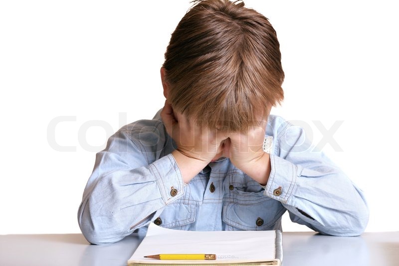A young boy very frustrated with school ... | Stock image | Colourbox