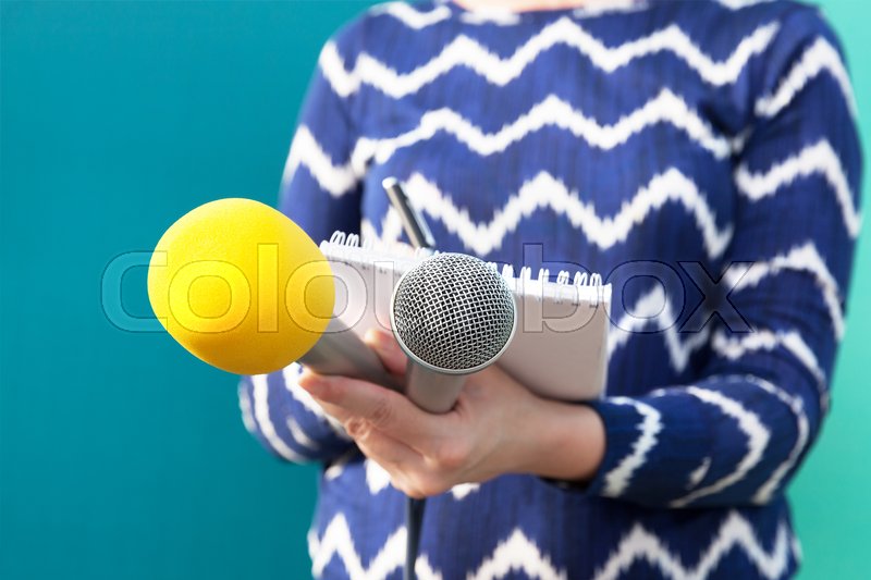 Female journalist taking notes at press ... | Stock image | Colourbox