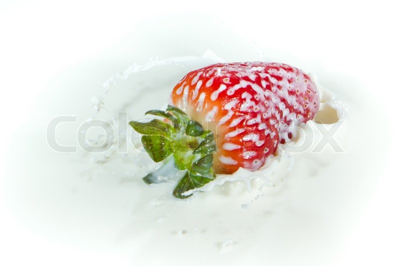 Delicious fresh strawberry falling into ... | Stock image | Colourbox