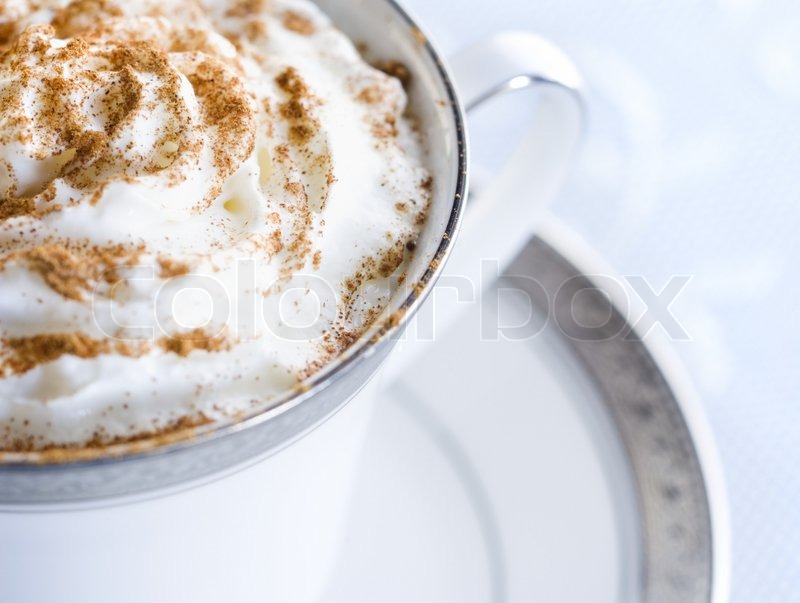 Close-up of coffee cup brimming with ... | Stock image | Colourbox