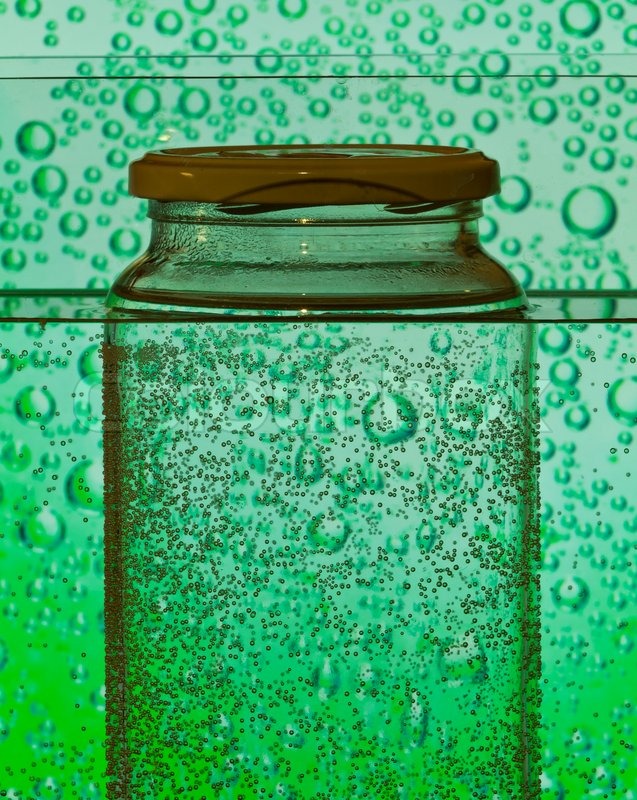 Glass bottle in a water tank as science ... | Stock image | Colourbox