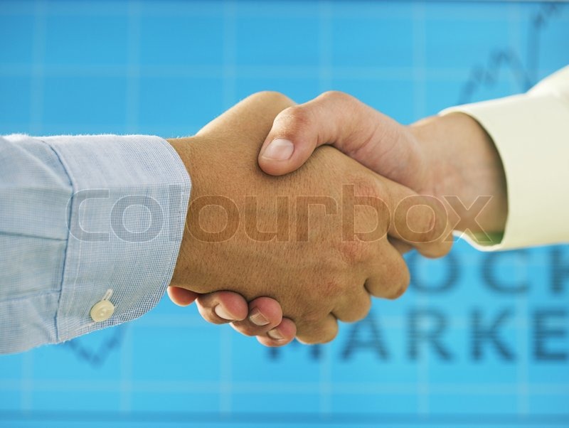 Two hand handshake isolated on blue ... | Stock image | Colourbox