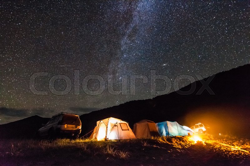 Tourist camping at sea coast at night ... | Stock Photo | Colourbox