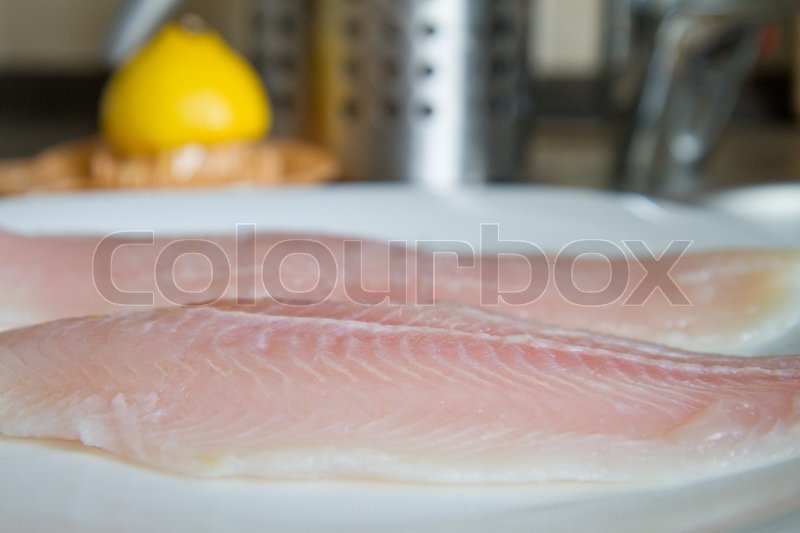 Raw fish fillet on a plate | Stock image | Colourbox