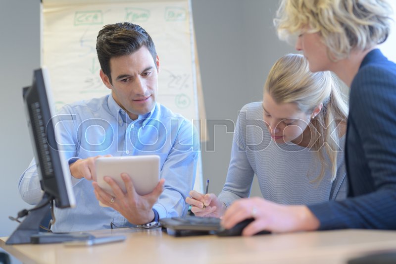 Team setting up a meeting | Stock image | Colourbox