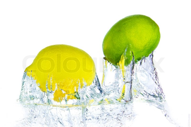Lime and lemon splashing water isolated ... | Stock image | Colourbox