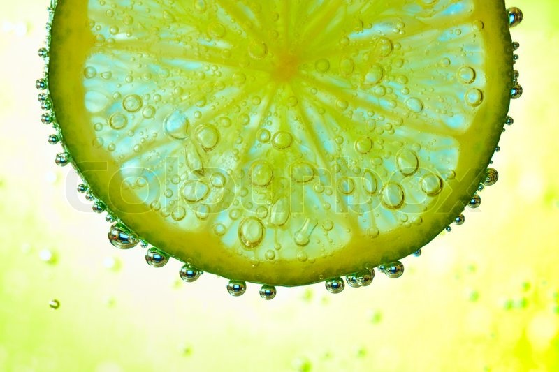 Slice of lime with bubbles | Stock image | Colourbox