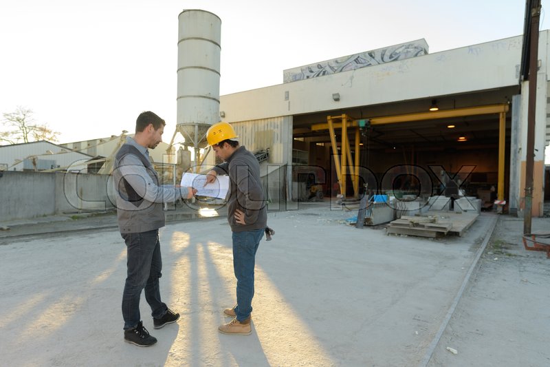 Workers outside of a factory | Stock image | Colourbox