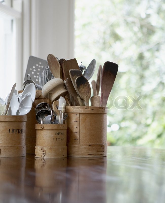 Kitchen utensils in containers on table ... | Stock Photo | Colourbox