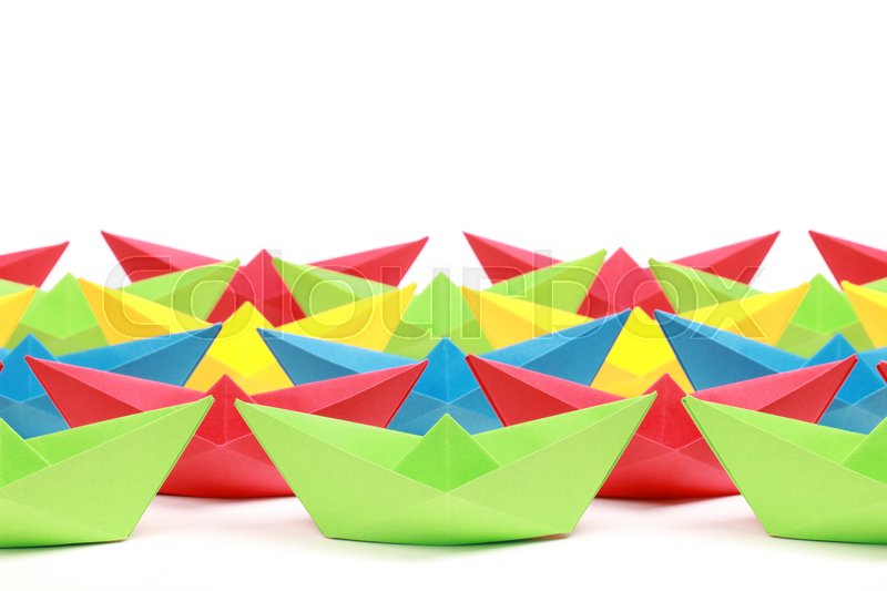 Several colored paper boats on white ... | Stock image | Colourbox