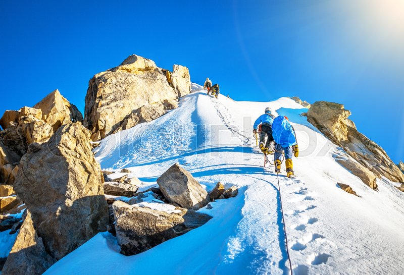 Group of climbers reaching the summit | Stock image | Colourbox