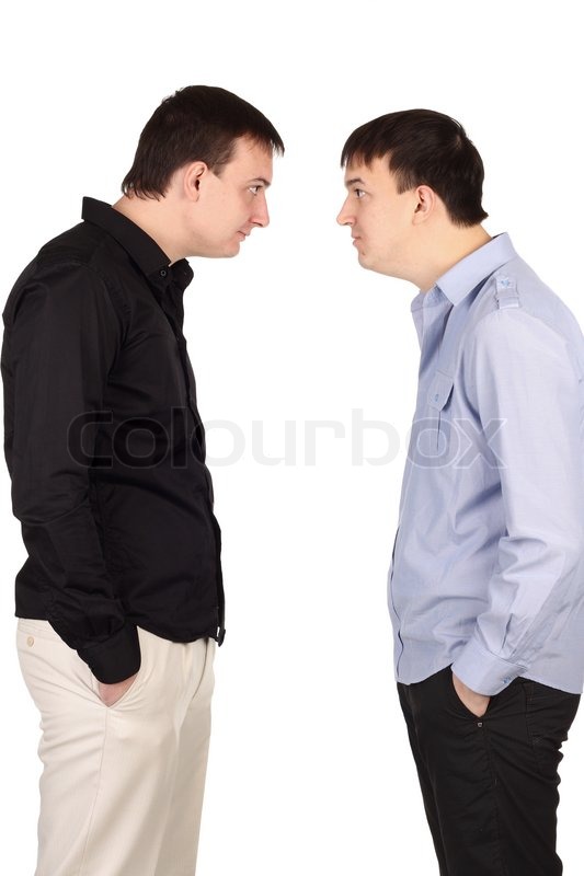 Two guys looking at each other at white ... | Stock image | Colourbox