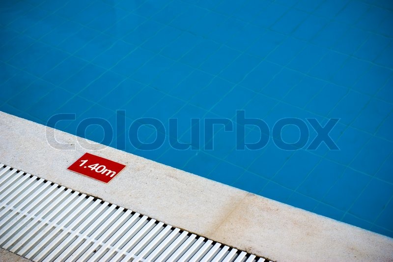 Pool depth sign at the edge of swimming pool | Stock Photo | Colourbox