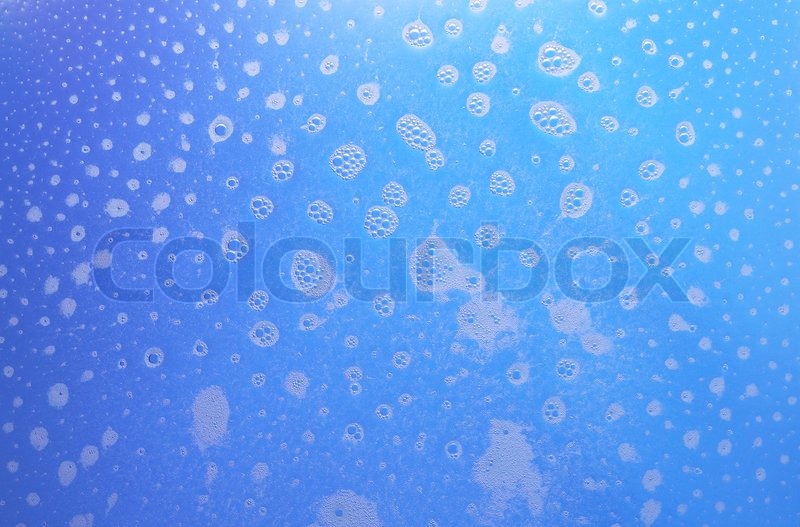 Abstract wet blue background with soap ... | Stock image | Colourbox