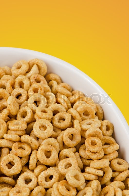 Round yellow cereals on red and yellow ... | Stock image | Colourbox