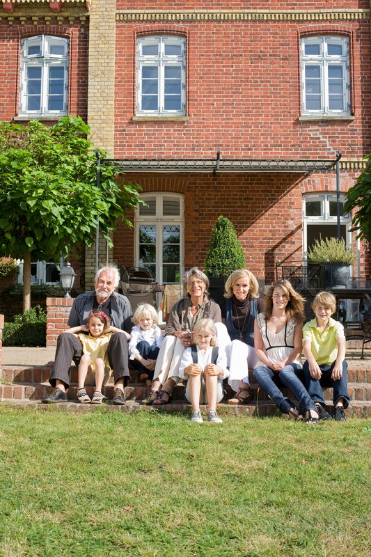 Family in front of their home | Stock image | Colourbox