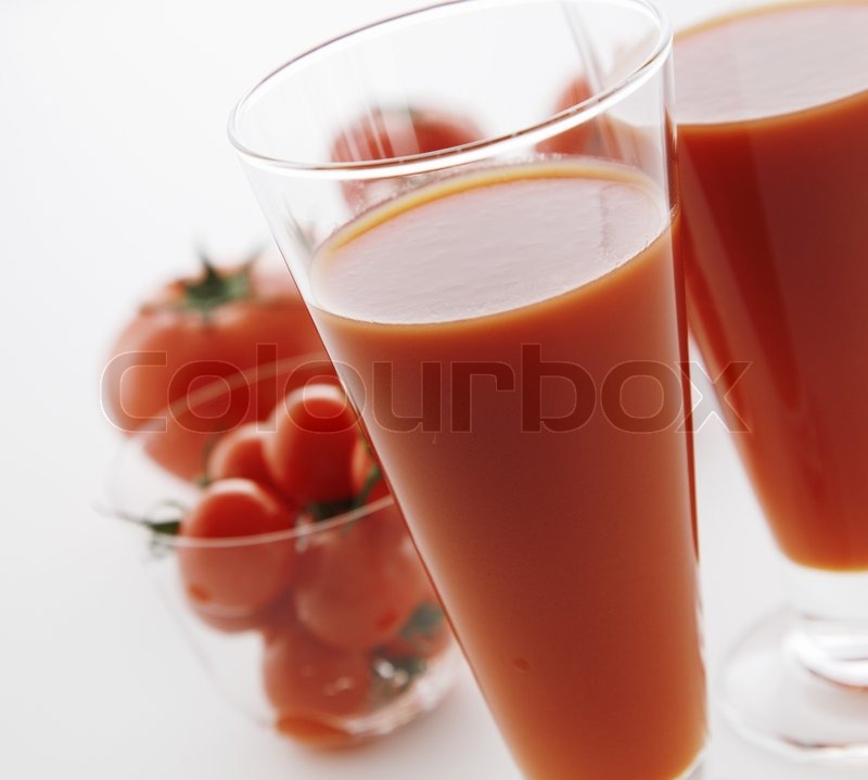 Glass of tomato juice and ripe tomatoes | Stock image | Colourbox