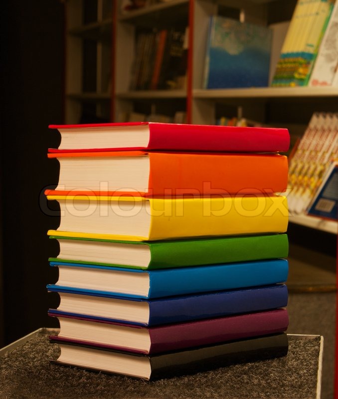 Pile of colorful books staying in the ... | Stock image | Colourbox