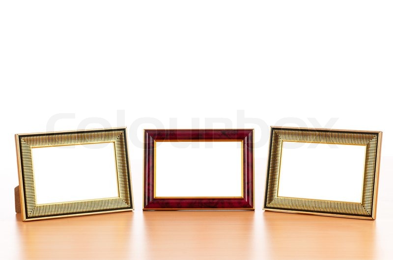 Photo frames on the table | Stock image | Colourbox