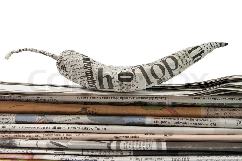 Newspaper pepper on a stack of ... | Stock image | Colourbox