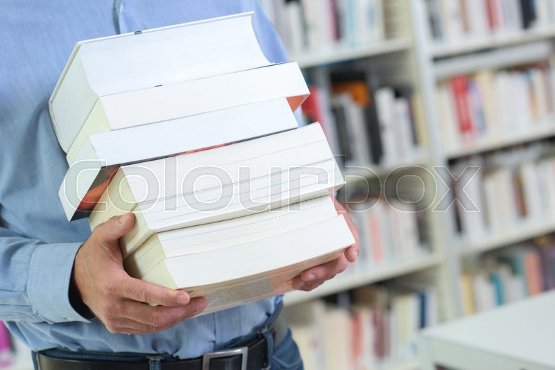 Arms carrying books | Stock image | Colourbox