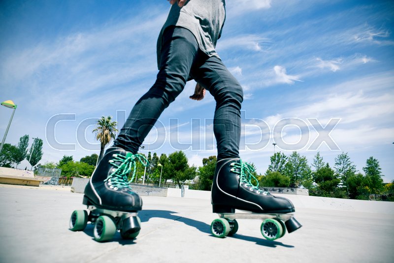 A young caucasian man roller skating ... | Stock image | Colourbox