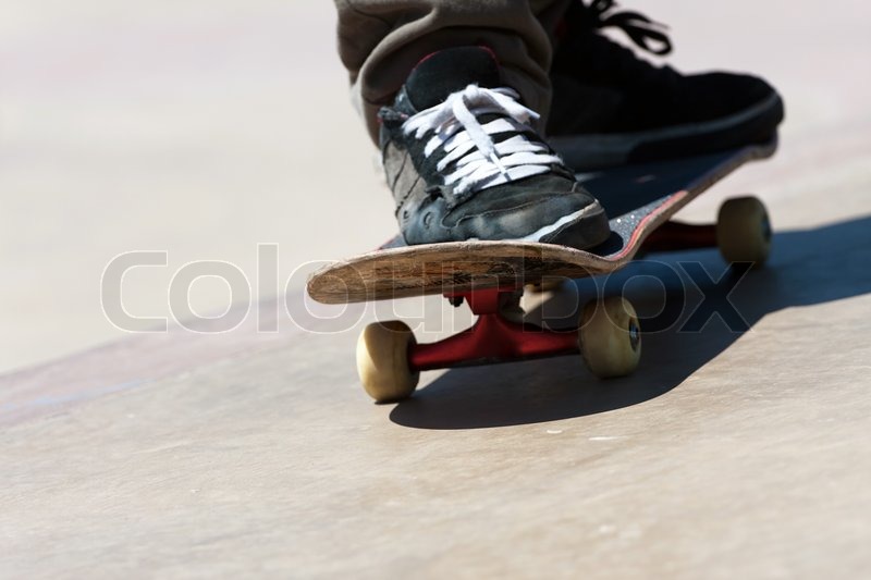 Close up of a skateboarders feet while ... | Stock image | Colourbox