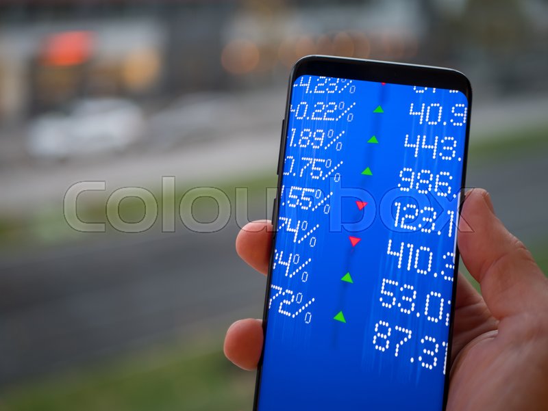 Smartphone with online stock trading ... | Stock image | Colourbox