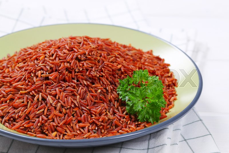 Plate of red rice on checkered ... | Stock image | Colourbox