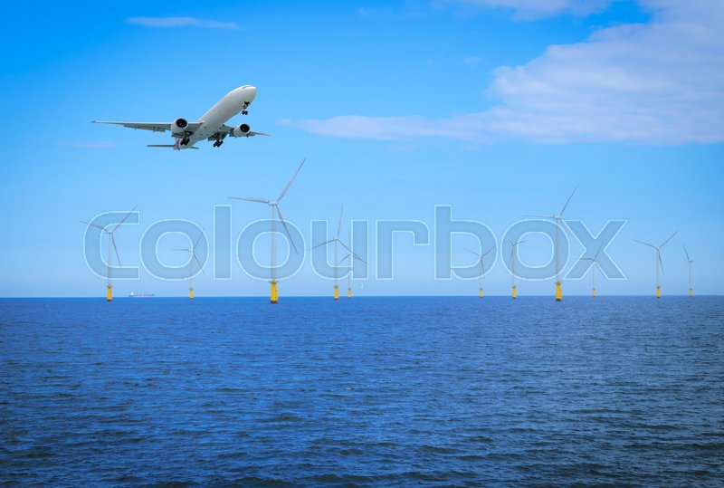 Offshore Wind Turbine with plane fly in ... | Stock image | Colourbox